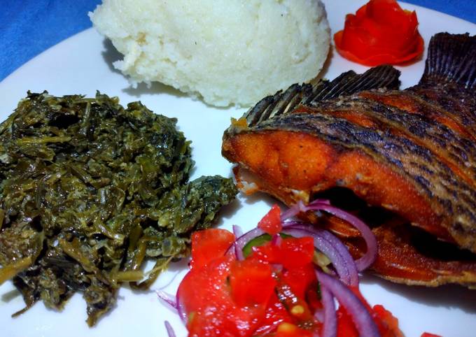 Wet fry fish served with Ugali and indigenous healthy veges - Trastar Cafe
